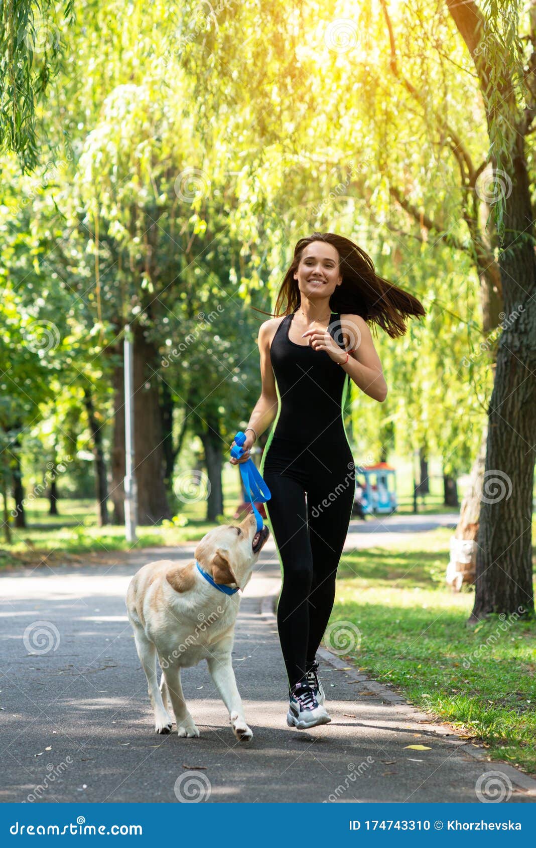 Cheerful Pretty Young Woman Walking and Running with Her Dog Stock ... Cheerful Pretty Young Woman Walking and Running with Her Dog Stock ...