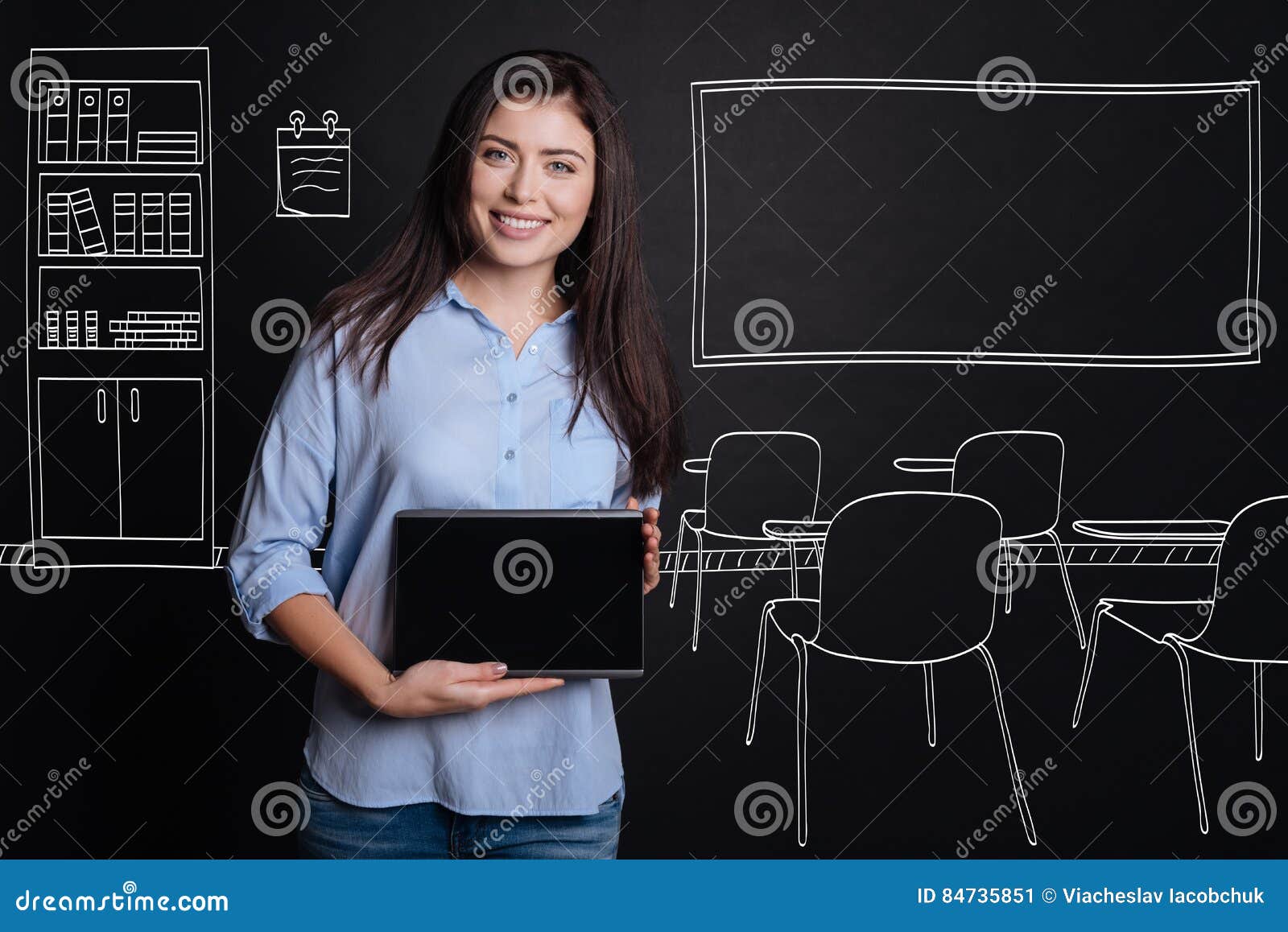 Cheerful Professional Teacher Standing In The Classroom Stock Image