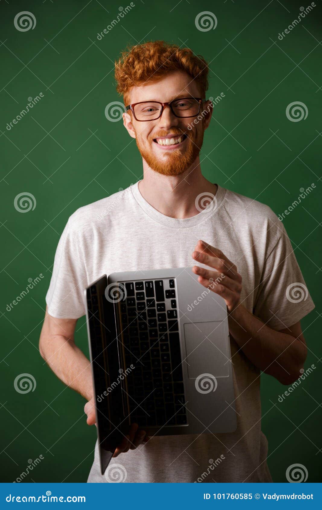 Cheerful Readhead Bearded Man In Glasses And White Tshirt Holding