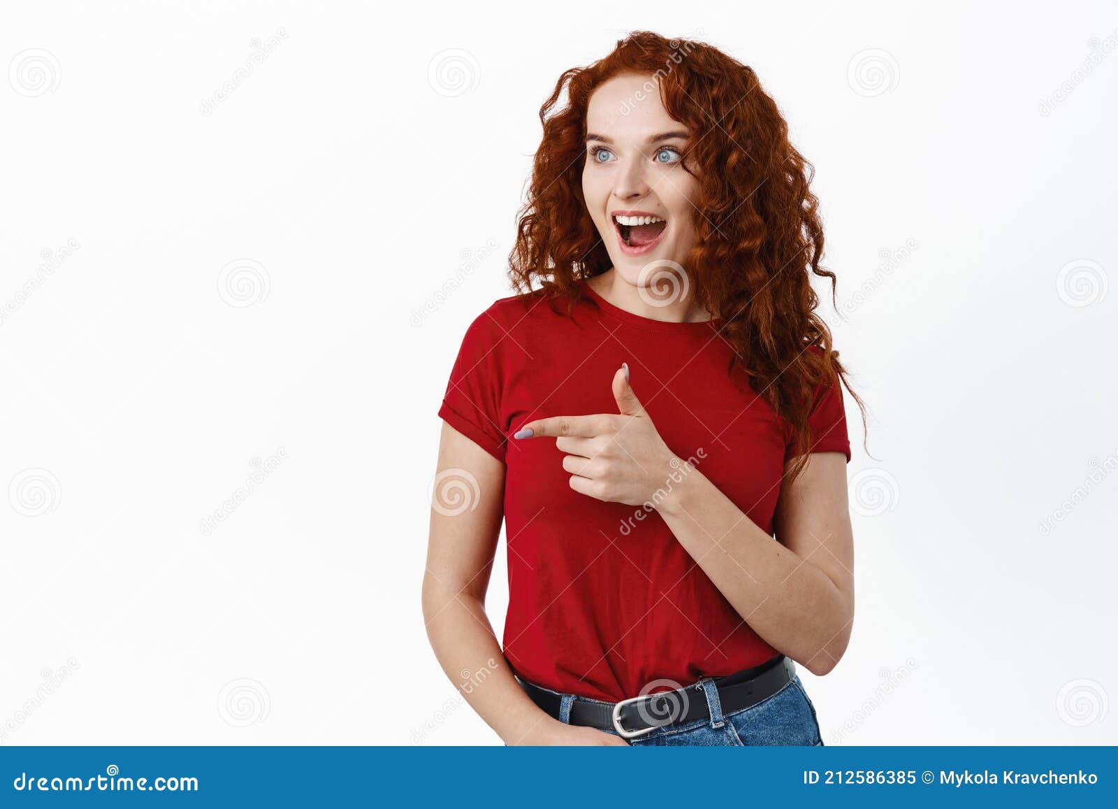 Cheerful Redhead Woman Smiling Pointing Finger Left And Looking At