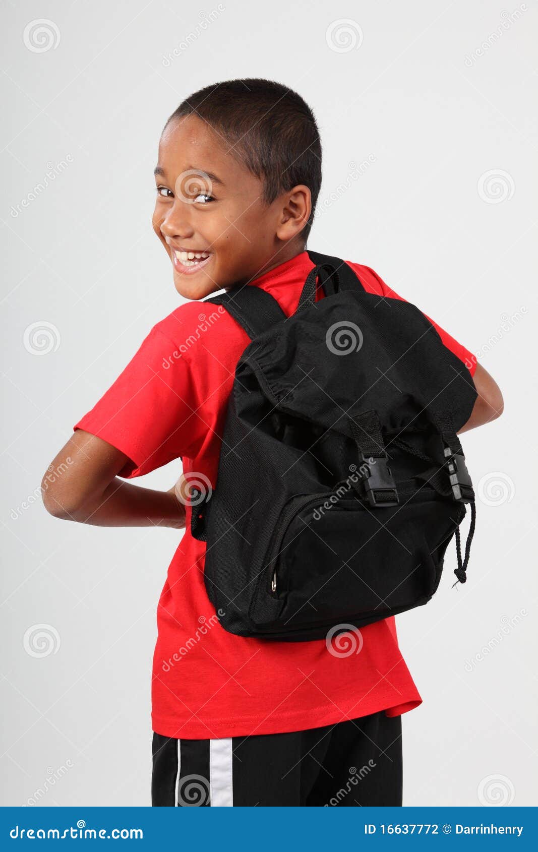 Cheerful School Boy Looking Back Over His Shoulder Stock Photo - Image ...