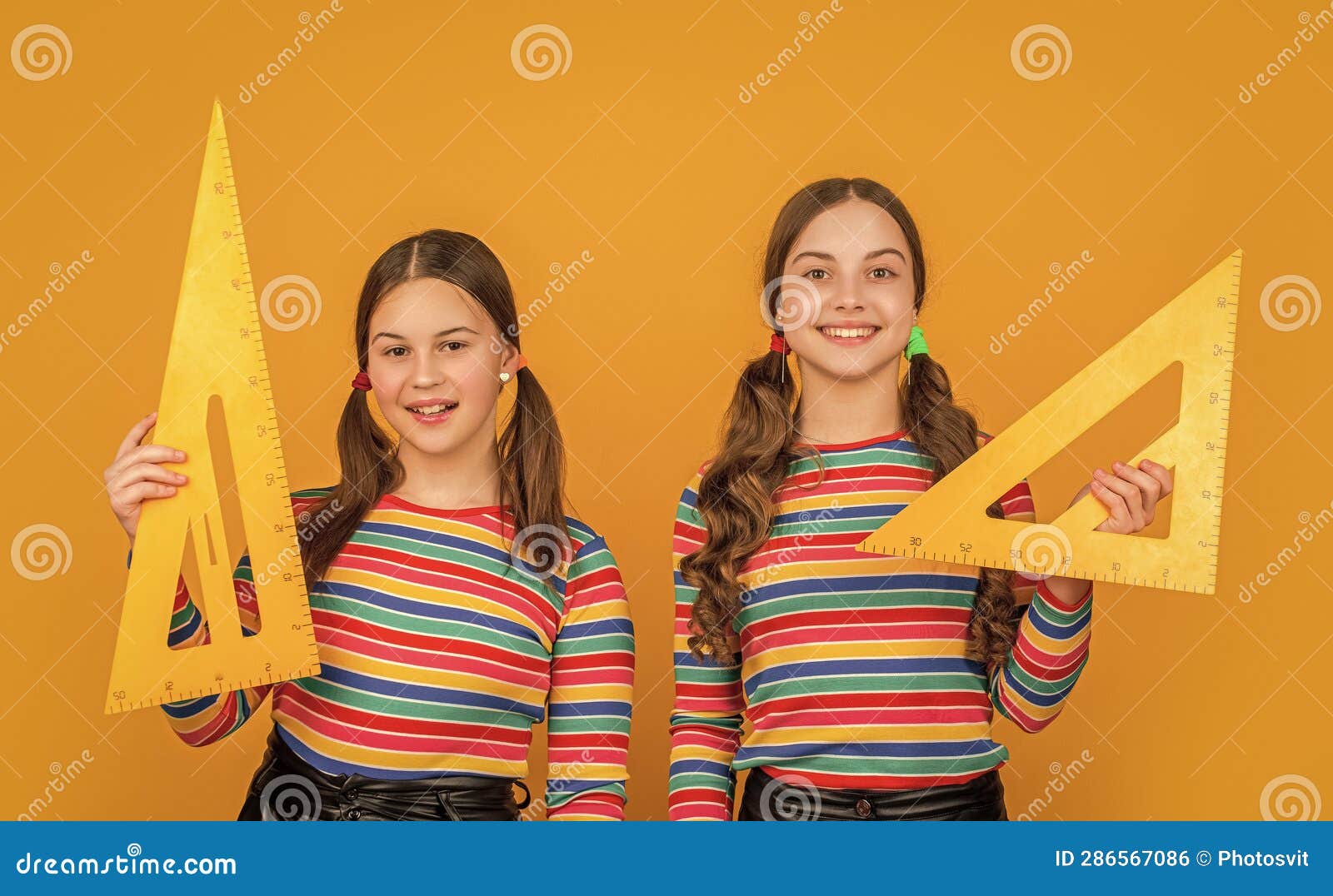 Cheerful School Children Hold Math Tool of Triangle Stock Photo - Image ...