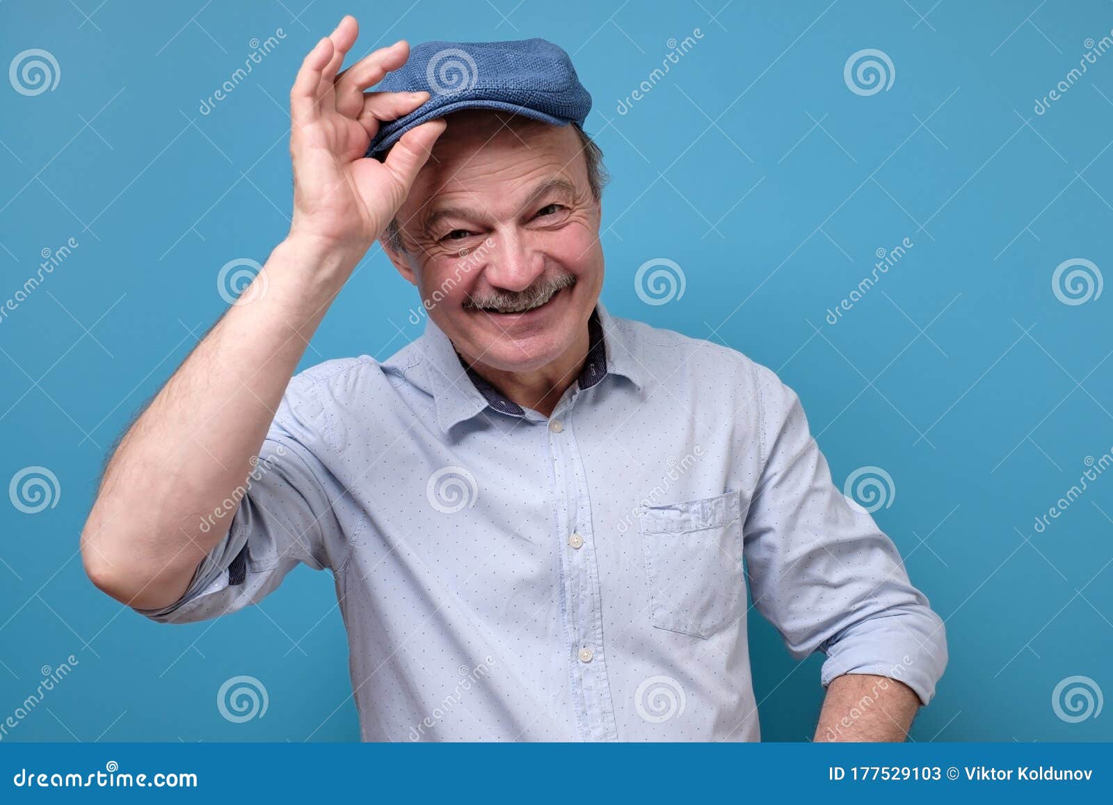 Cheerful Senior Man Greets by Taking Off a Hat Stock Image - Image of ...