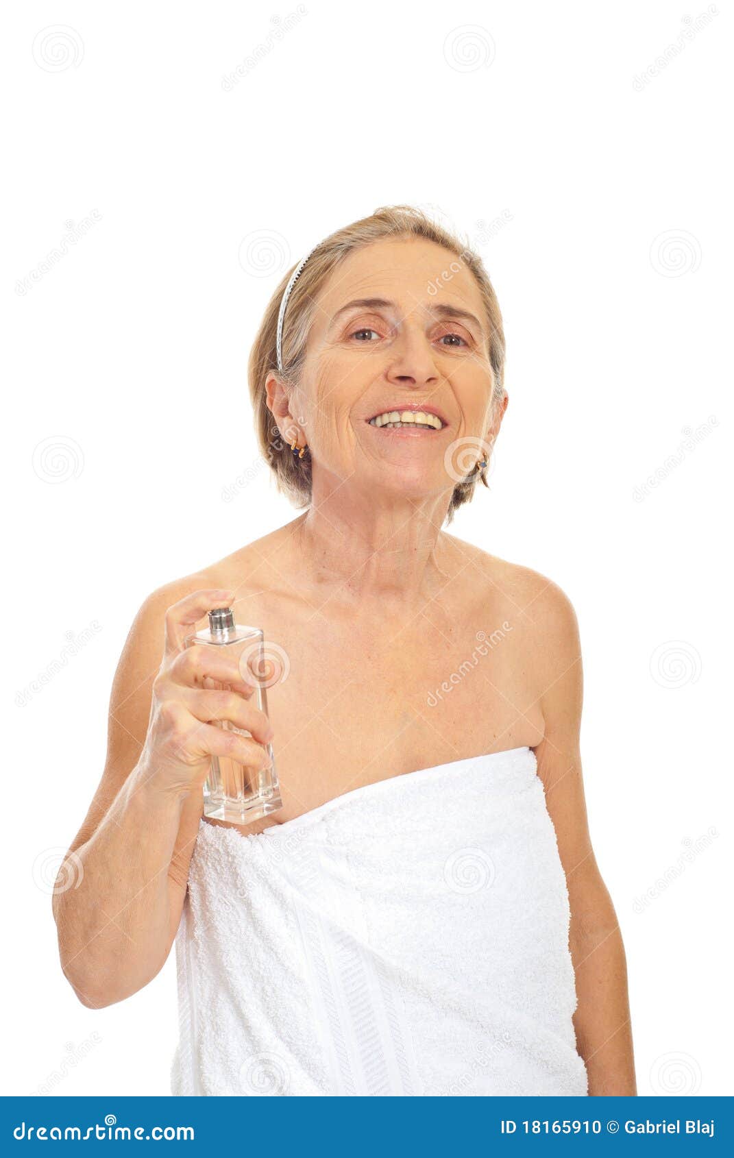 Cheerful Senior Woman Applying Perfume Stock Photo - Image of smile ...