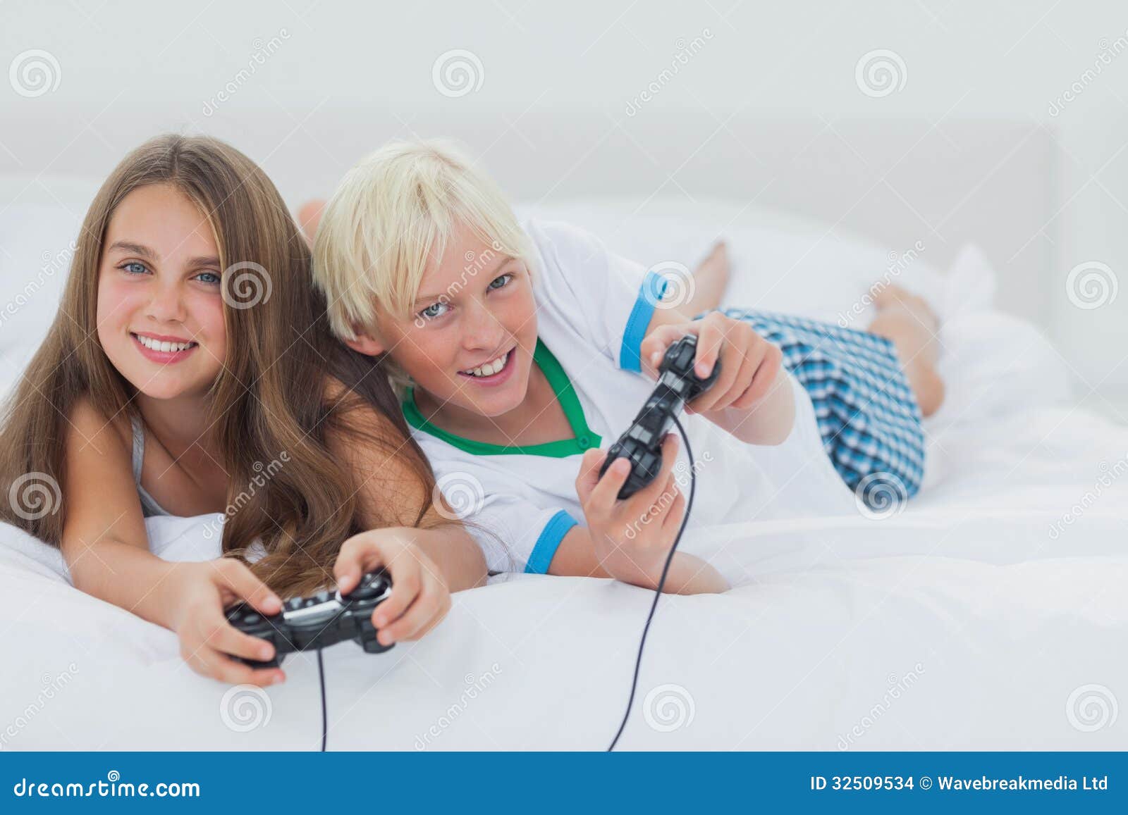 Two Siblings Playing At Beautiful Green Park Together. Happy Family Of ...