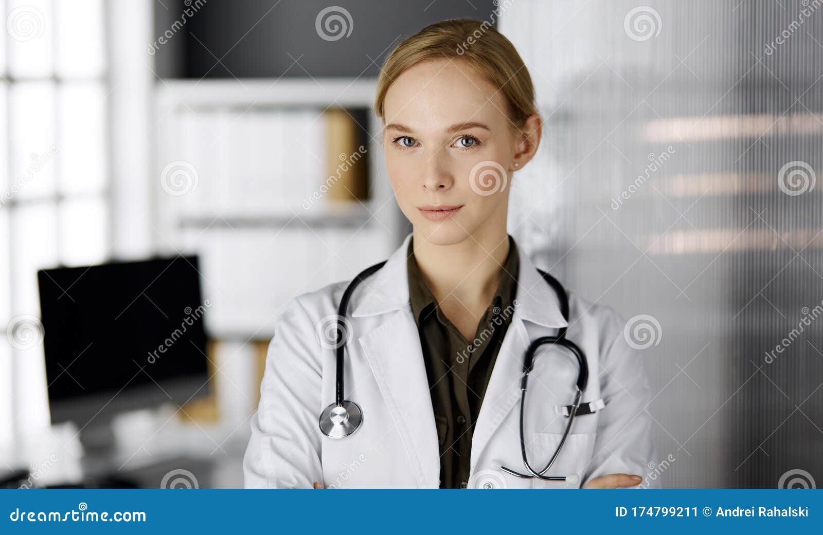 Cheerful Smiling Female Doctor Standing In Clinic Portrait Of Friendly
