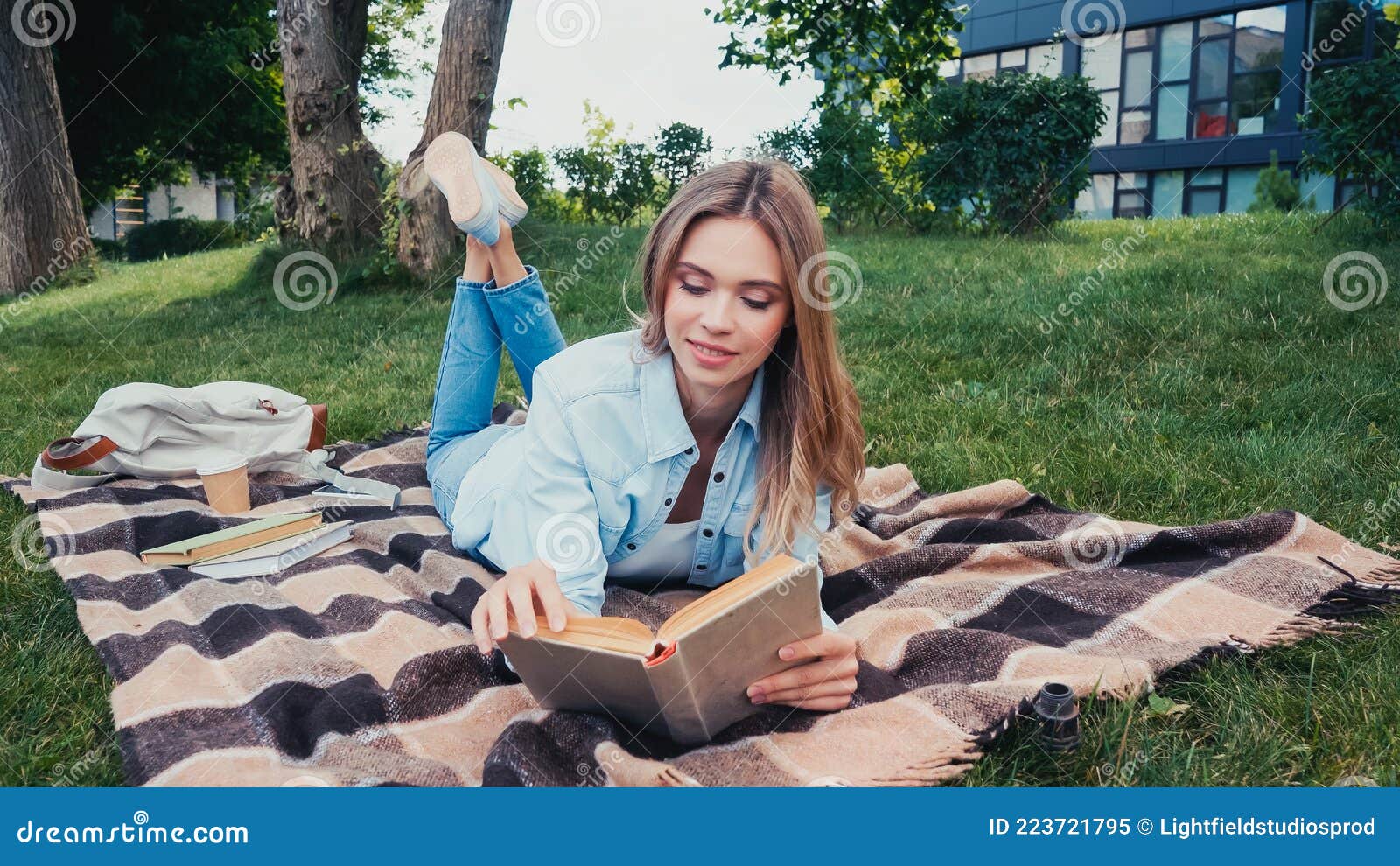 Cheerful Student Reading Book while Lying Stock Image - Image of ...
