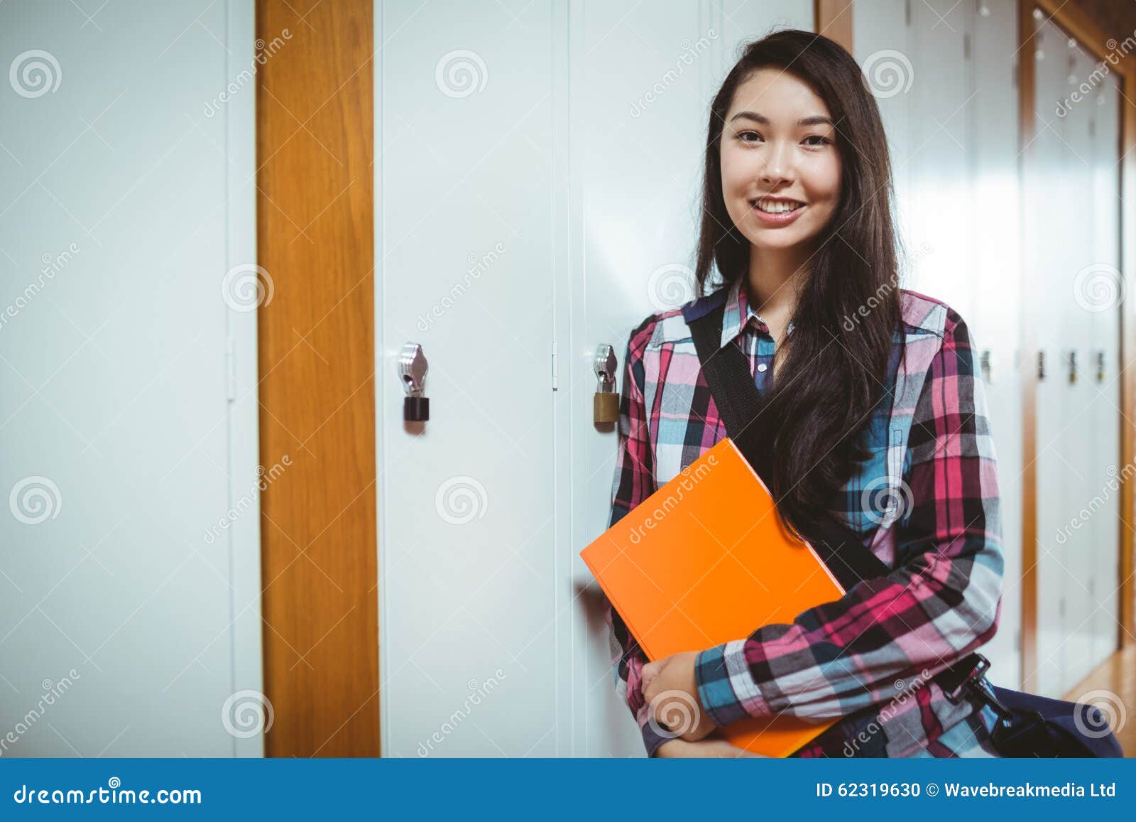 Cheerful Student Standing Next the Locker Stock Photo - Image of locker ...