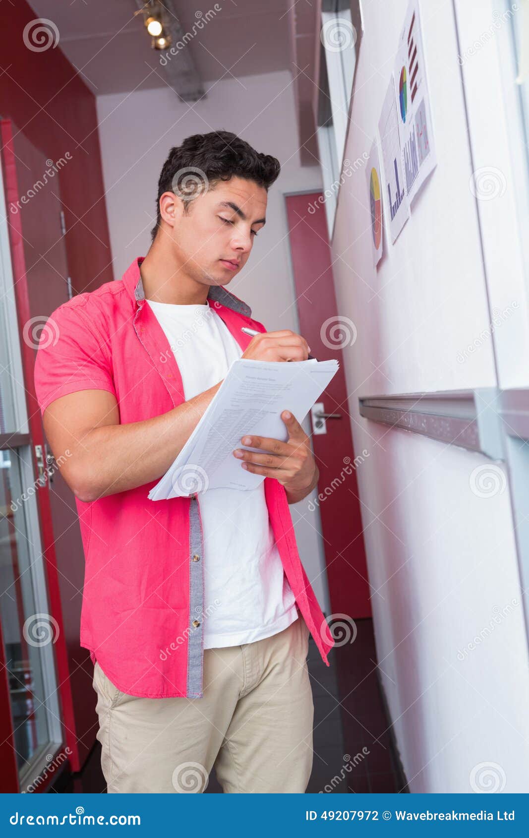 Cheerful Student Standing Taking Notes Stock Photo - Image of student ...