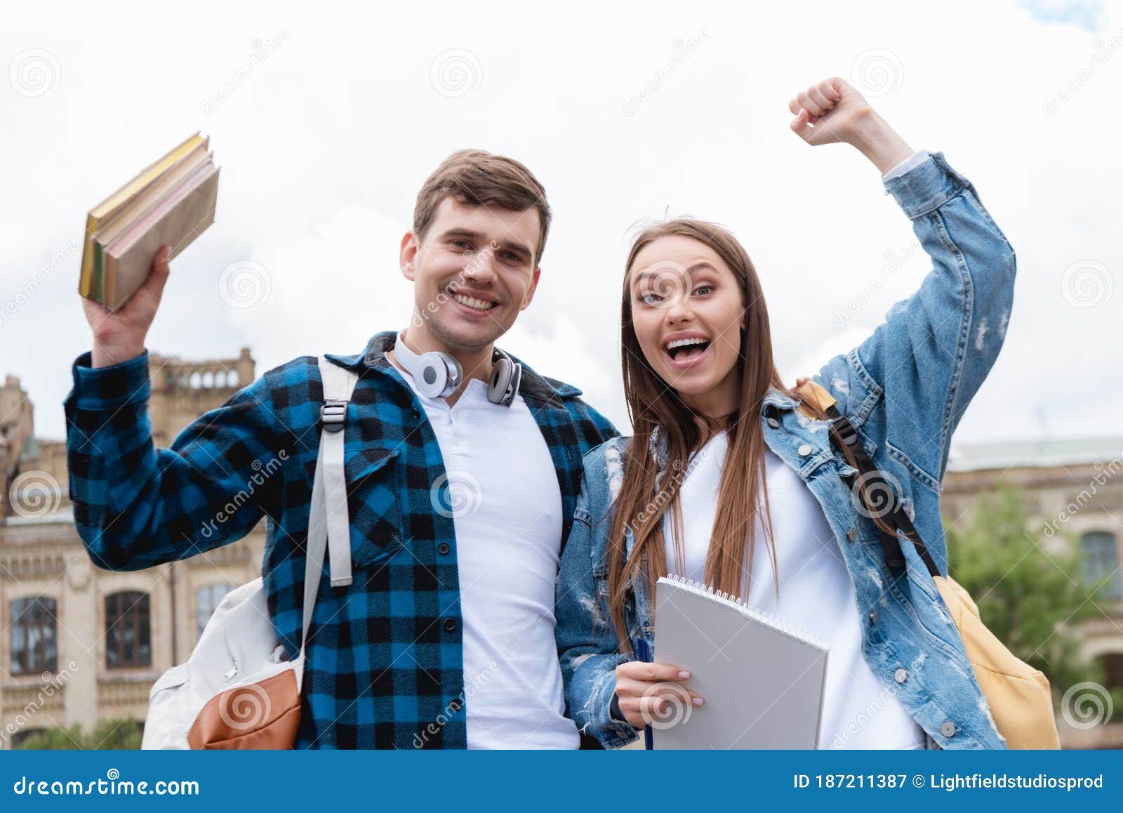 Students Celebrating Triumph while Looking at Stock Image - Image of ...