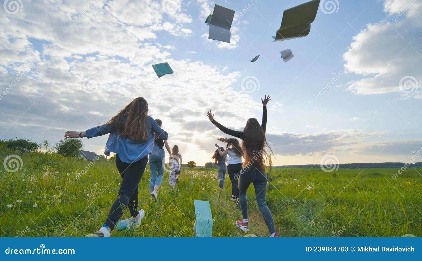 Cheerful Students Run Throwing Notebooks after School at Sunset. Stock ...