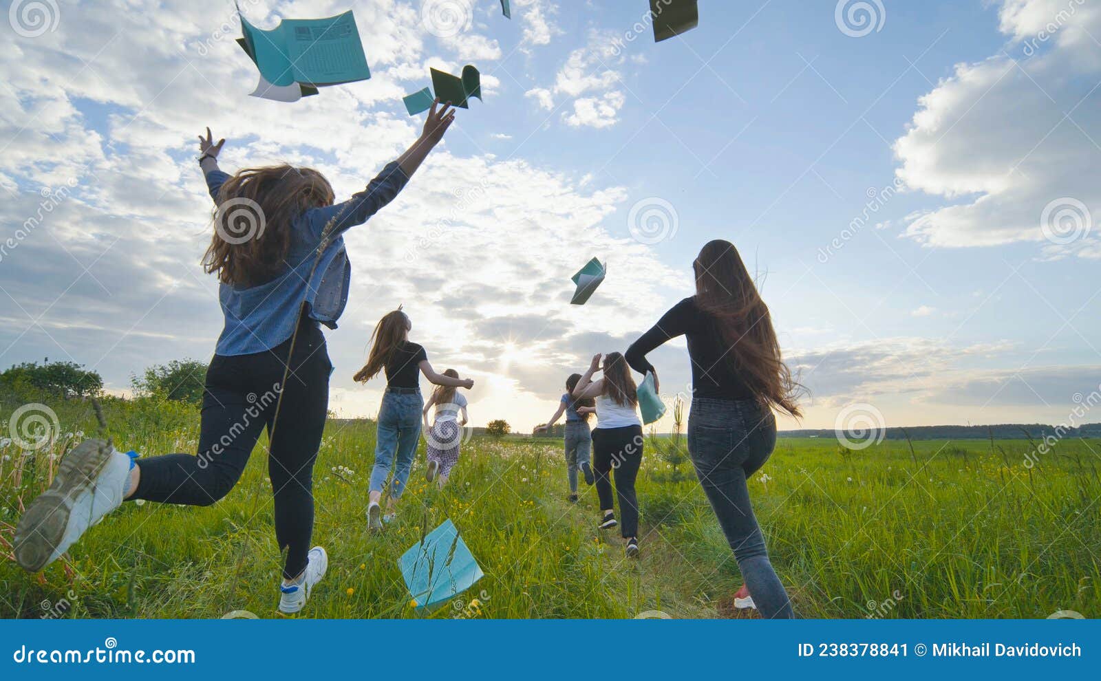 Cheerful Students Run Throwing Notebooks after School at Sunset. Stock ...