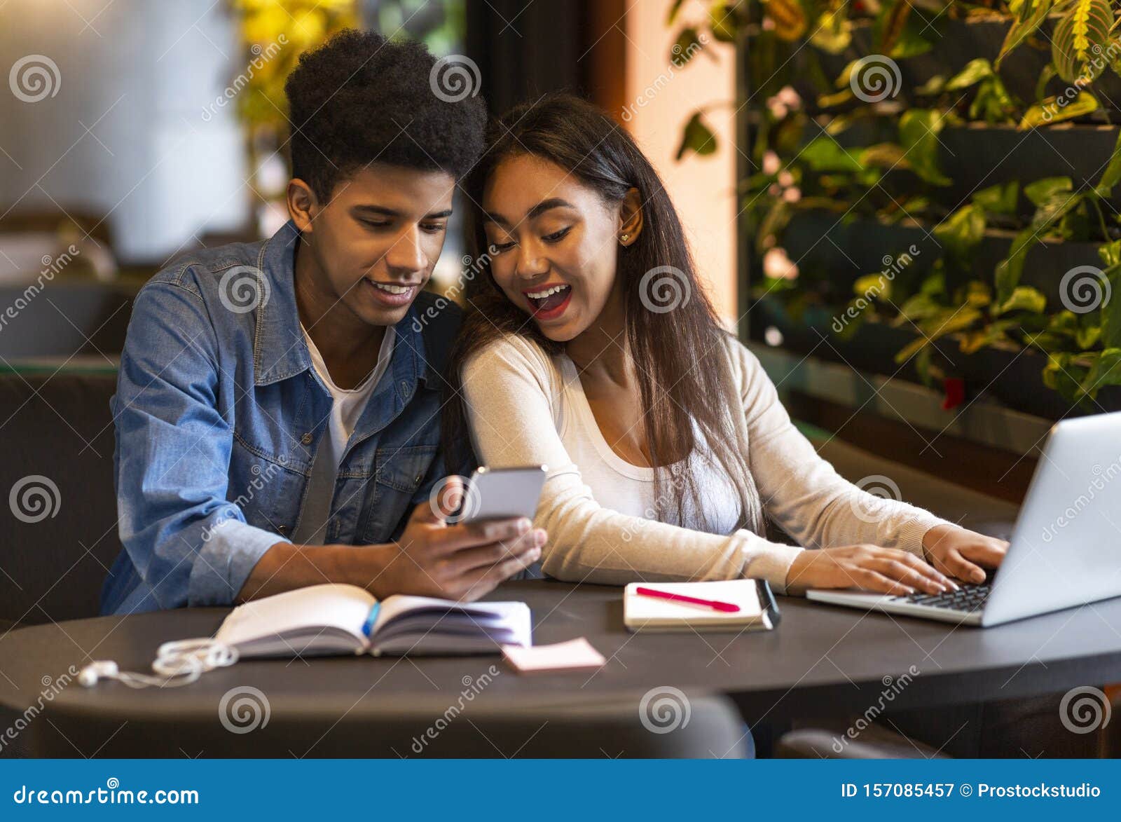 Cheerful Students Using Mobile Application for Studying Stock Image ...