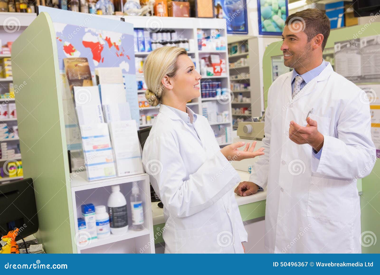 Cheerful Team of Pharmacist Talking Together Stock Image - Image of ...