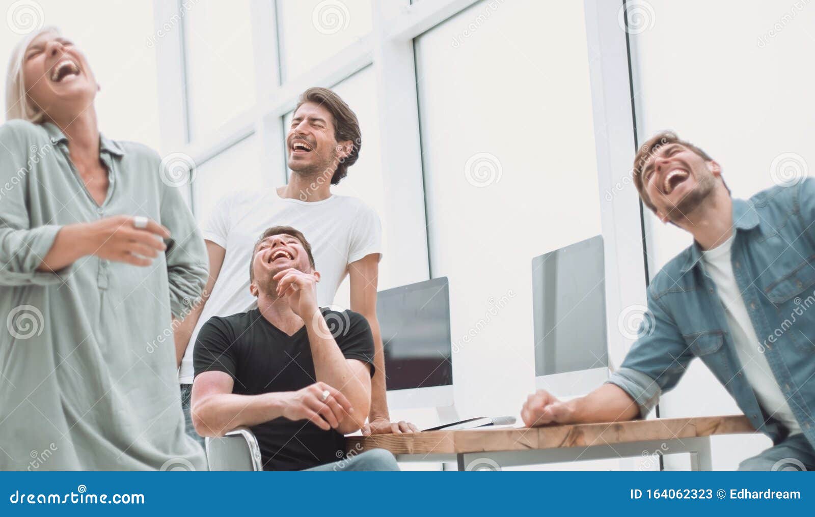 Cheerful Team of Young People in the Workplace. Stock Image - Image of ...
