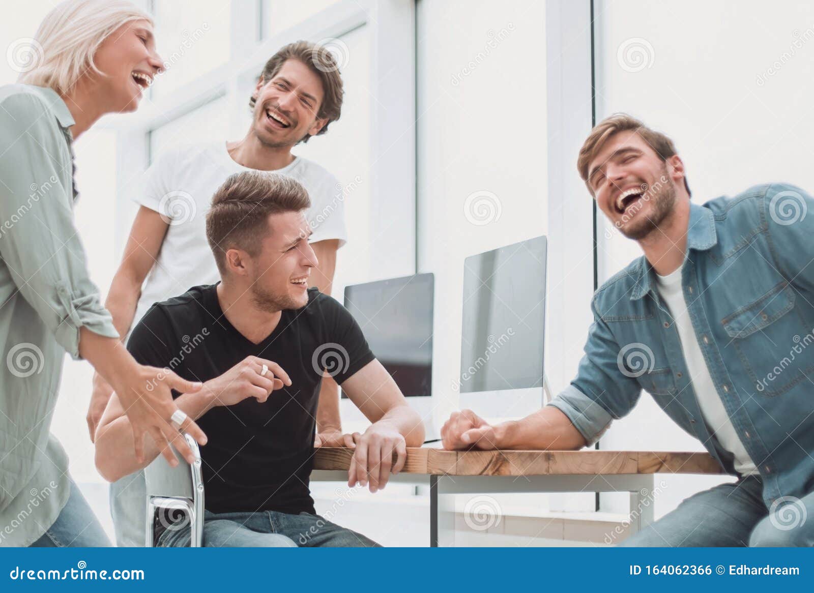 Cheerful Team of Young People in the Workplace. Stock Photo - Image of ...