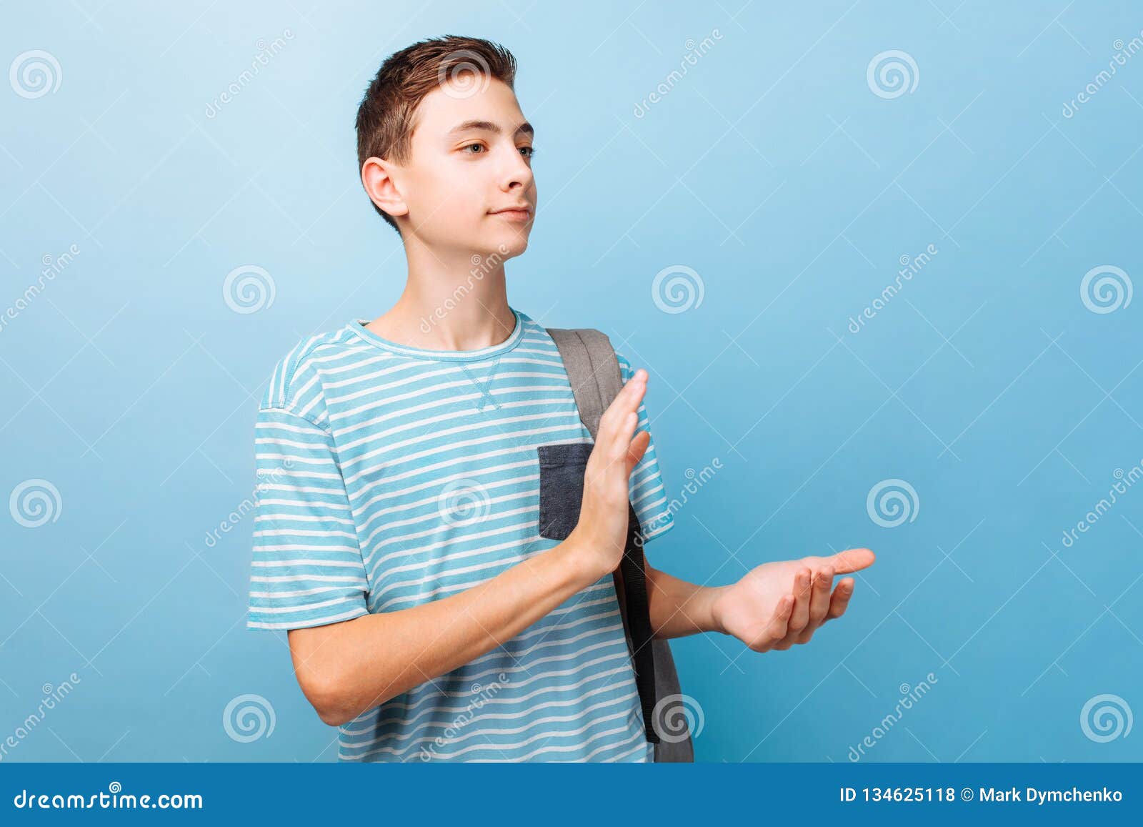 Cheerful Teenager with Clapping Hands, on a Blue Background Stock Photo ...