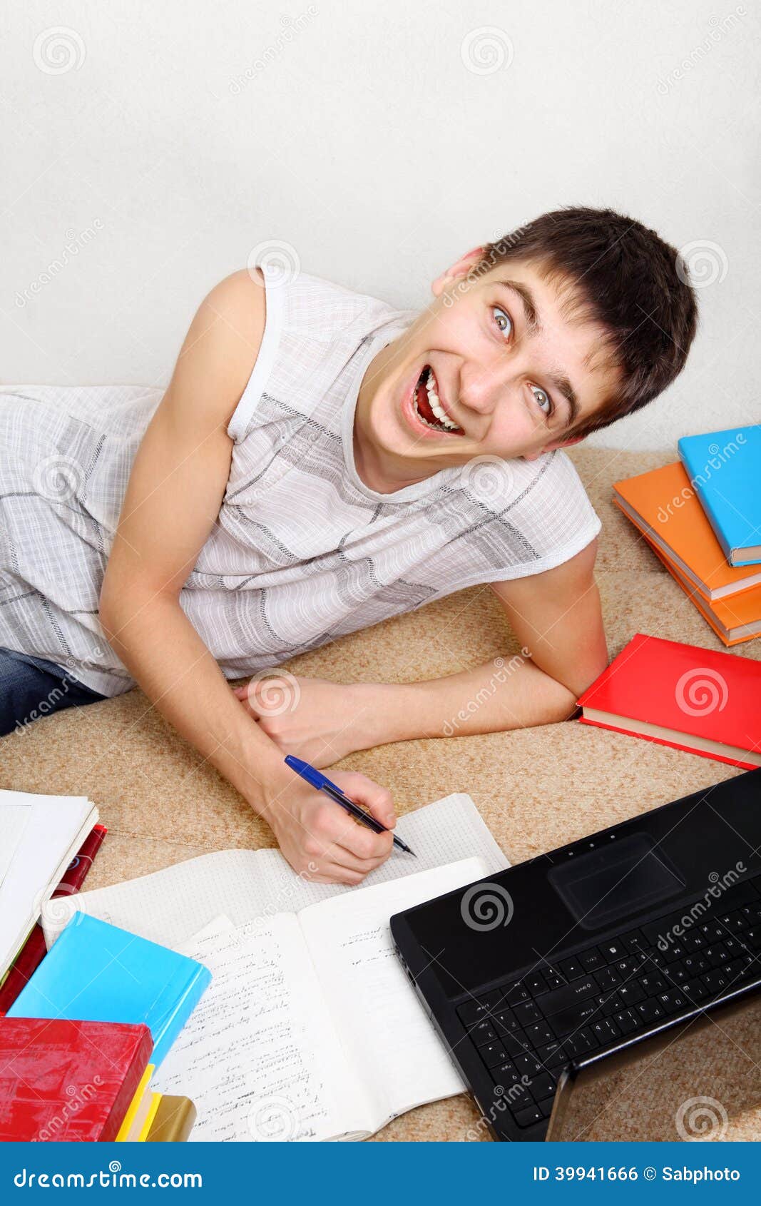 Cheerful Teenager Doing Homework Stock Photo - Image of home, device ...