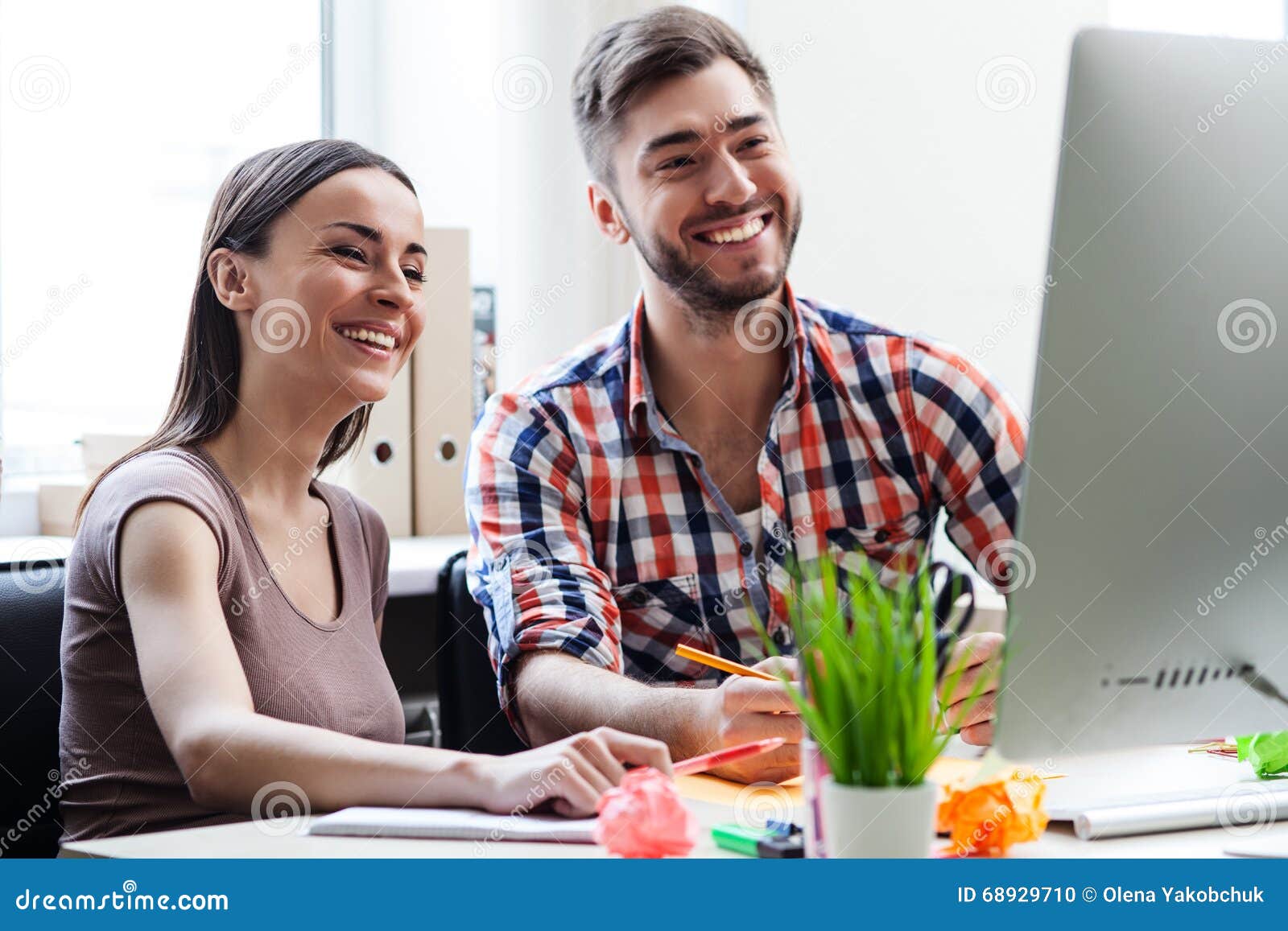 Cheerful Two Colleagues are Using Laptop for Work Stock Photo - Image ...