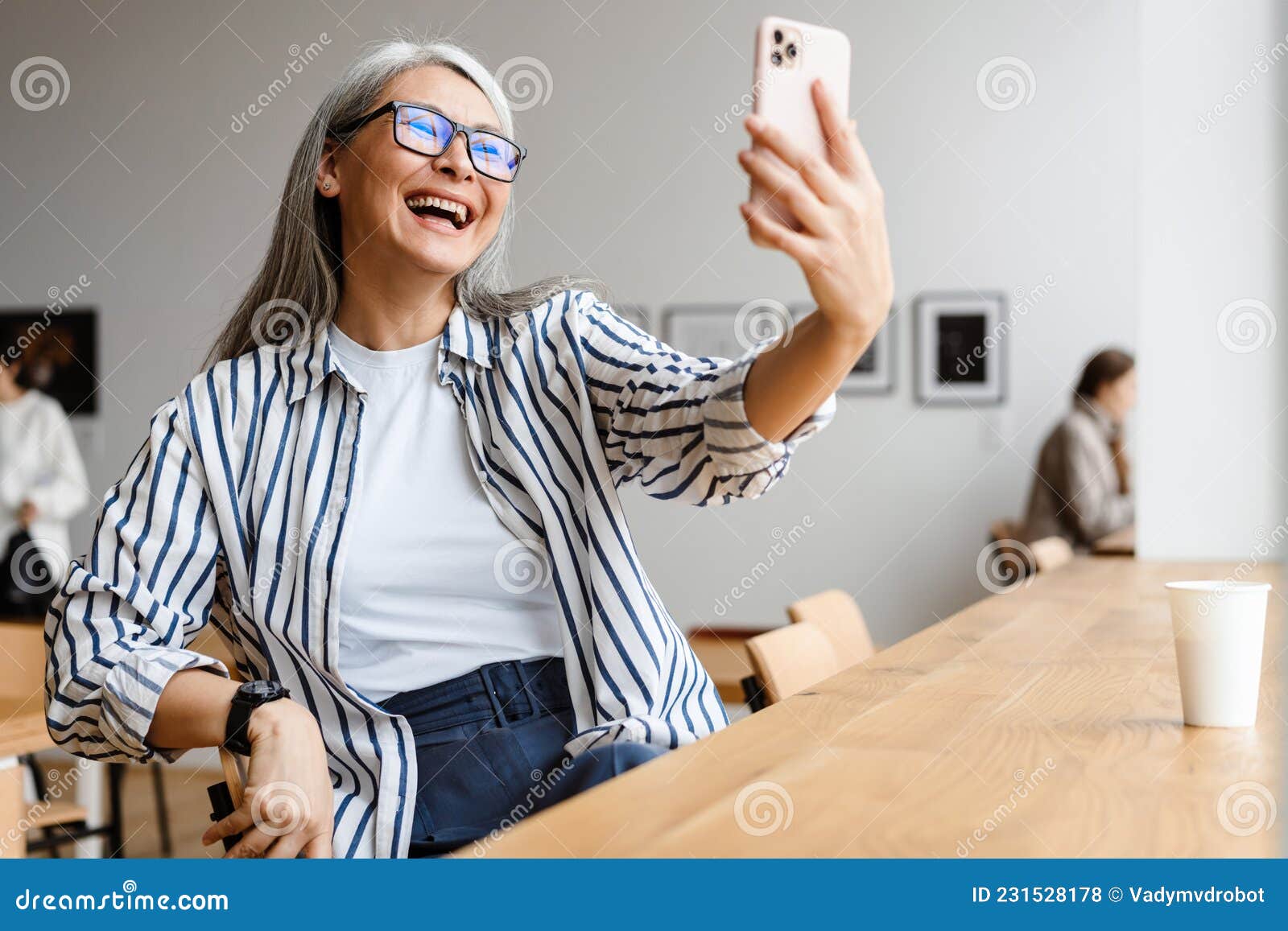 Cheerful Woman Laughing And Taking Selfie Photo On Cellphone Stock