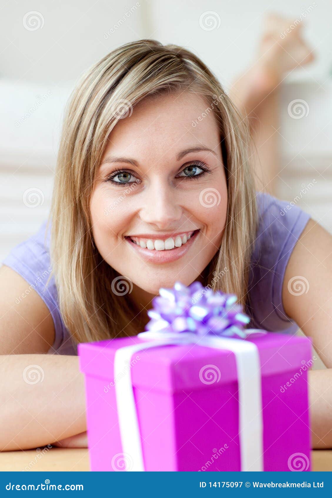 Cheerful Woman Looking at a Gift Stock Image - Image of female, holiday ...