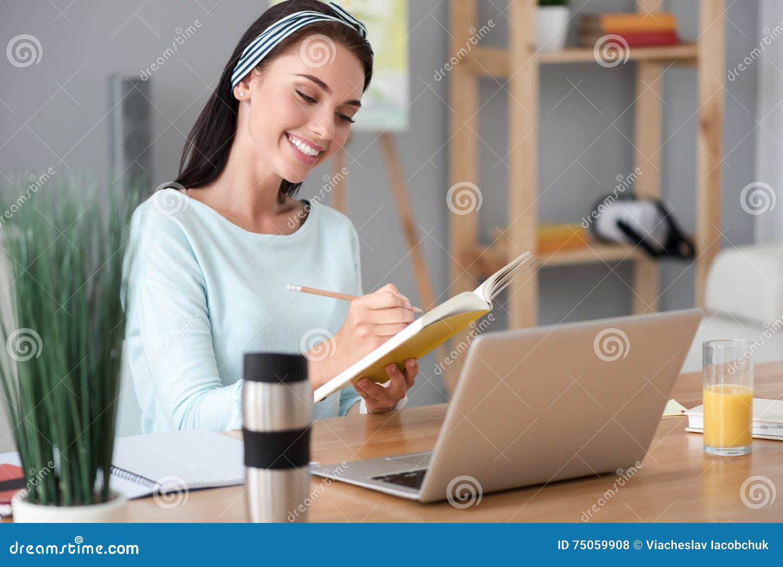 Cheerful Woman Making Notes. Stock Photo - Image of online, daytime ...