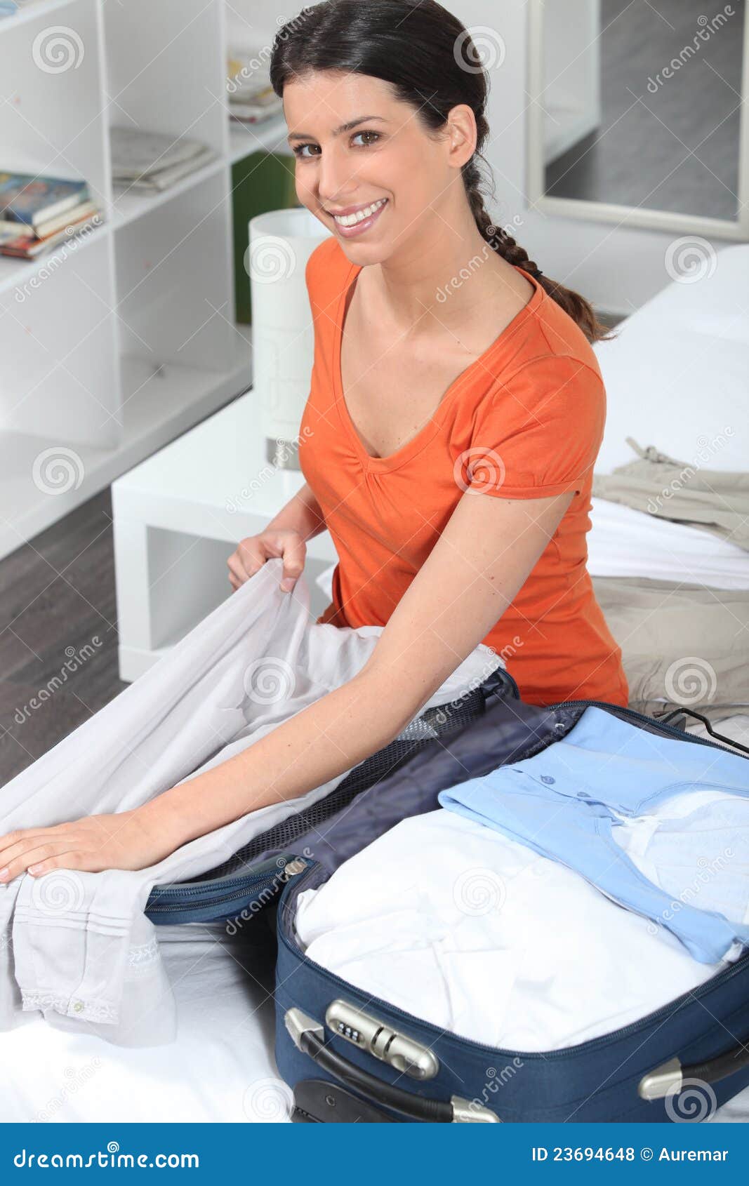 Cheerful woman packing stock photo. Image of elegance - 23694648