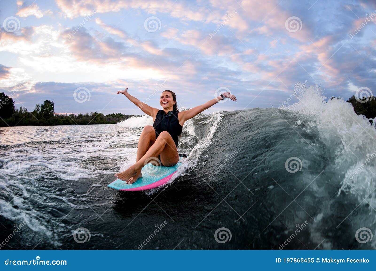 Cheerful Woman Riding Wave While Sitting On Surf Style Wakeboard With
