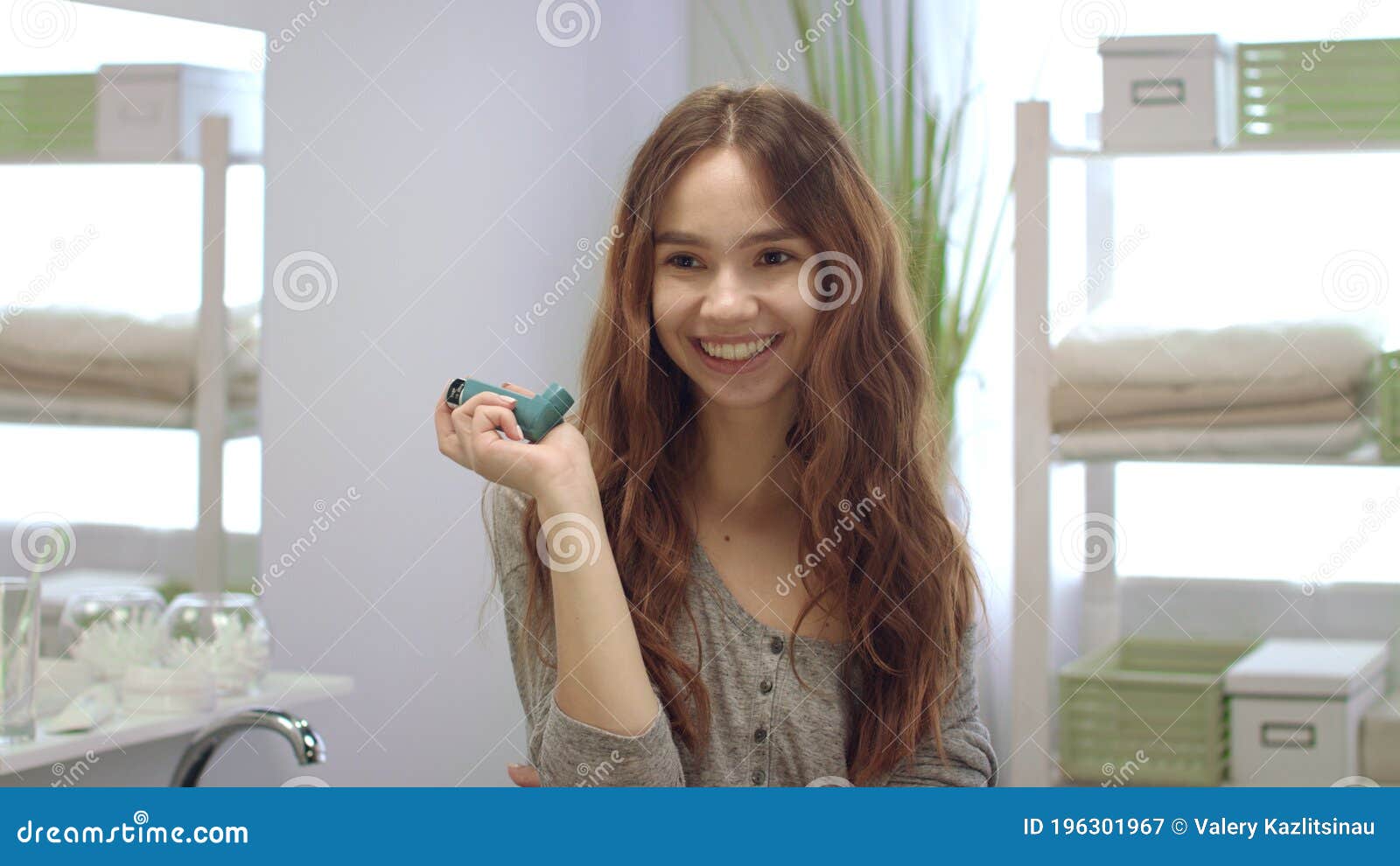Cheerful Woman Spraying Oral Aerosol For Fresh Breath In Mouth In Bath