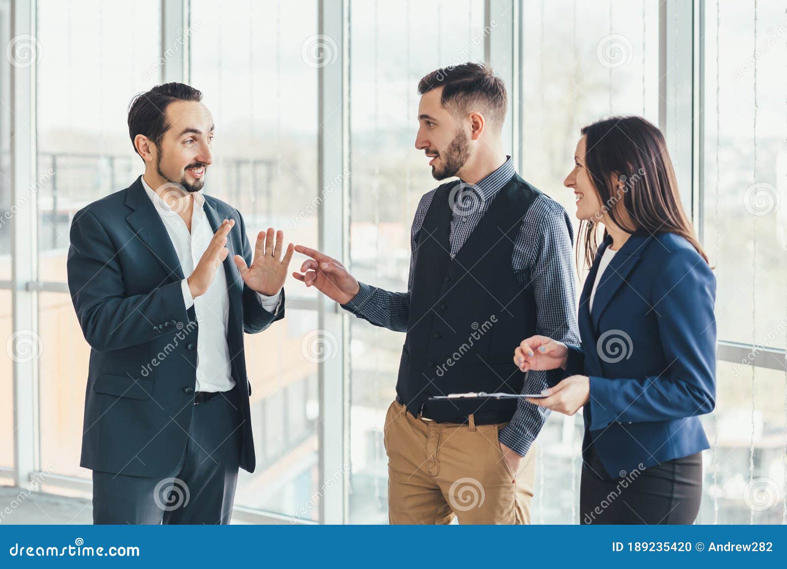 Cheerful Work Team during Break Time in Office, Chatting Lively. Stock ...