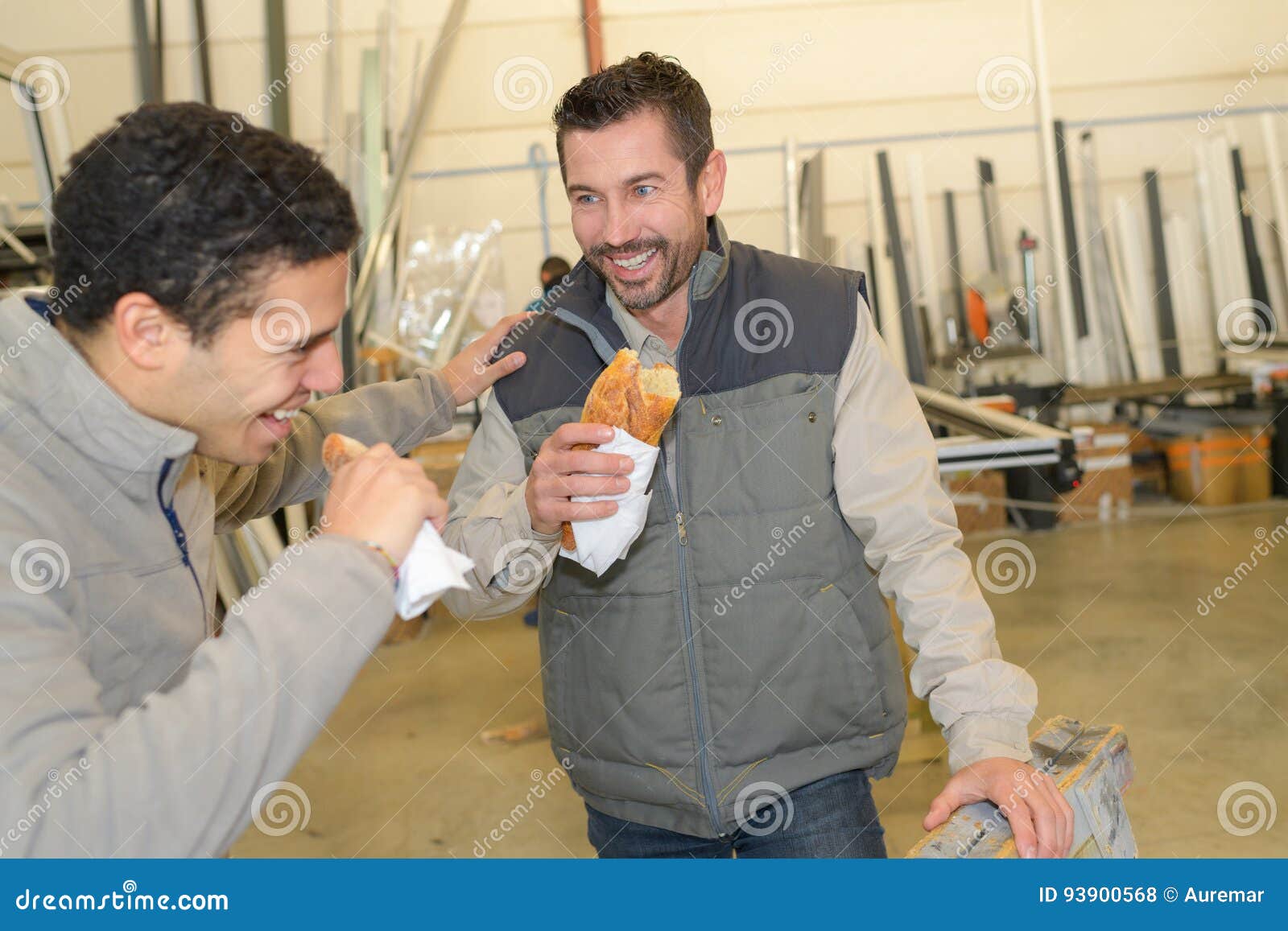 Cheerful Workers Having Lunch Eating Sandwich in Workshop Stock Photo ...