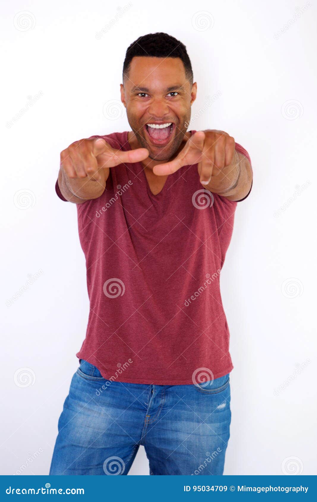 Cheerful Young African Man Pointing Fingers On White Background Stock ... Cheerful Young African Man Pointing Fingers On White Background Stock ...