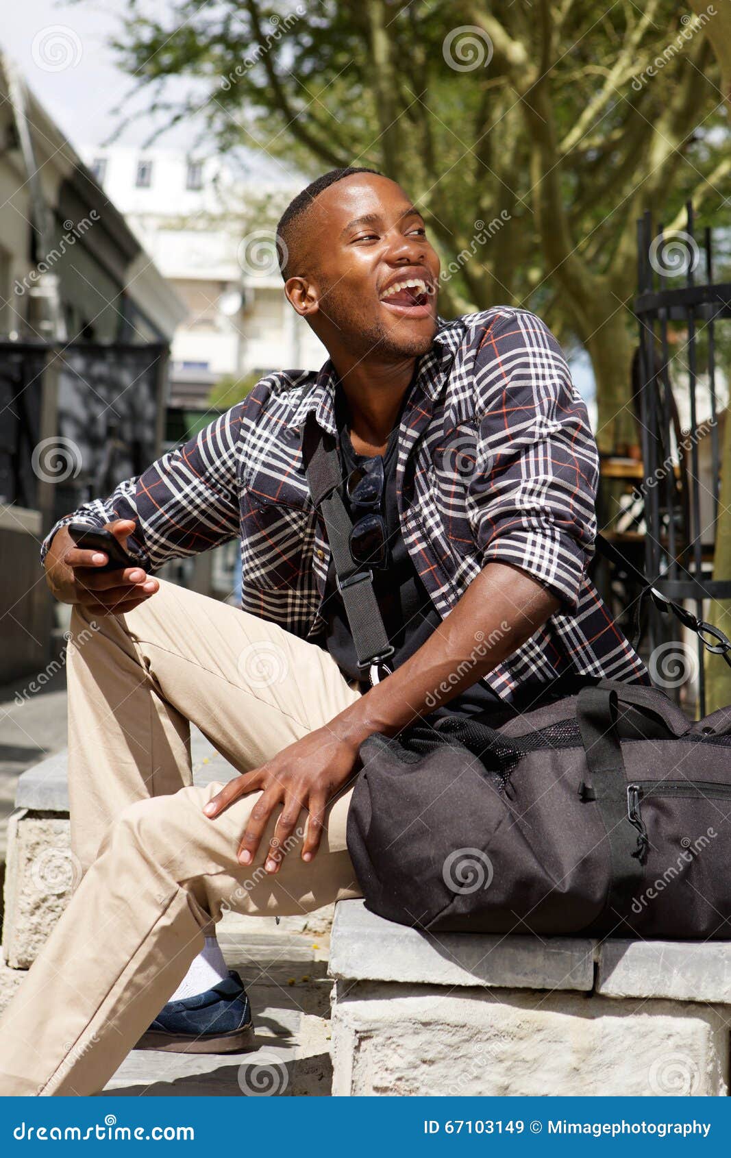 Cheerful Young African Man Sitting by the Street Stock Image - Image of ... Cheerful Young African Man Sitting by the Street Stock Image - Image of ...