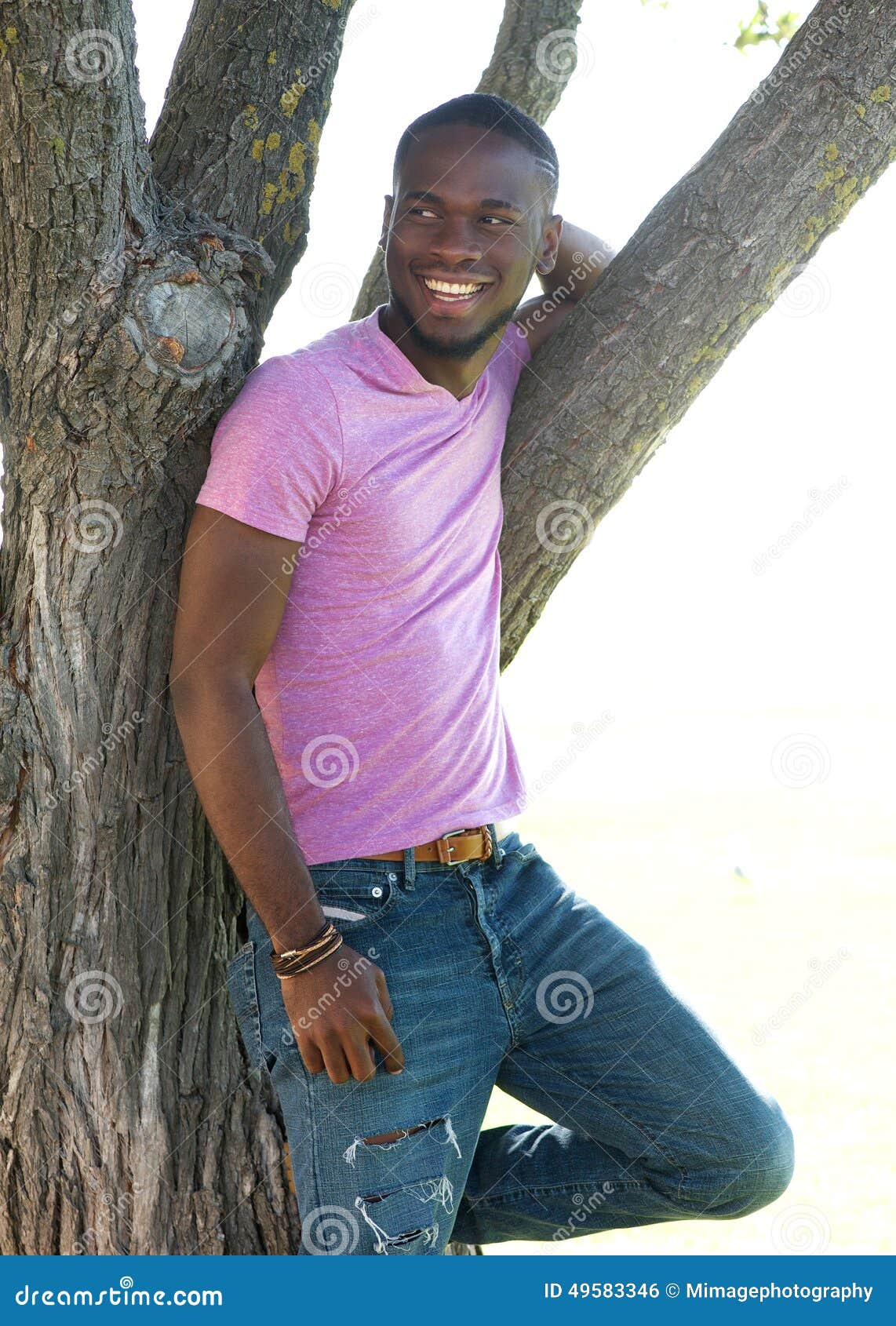 Cheerful Young Black Man Relaxing by Tree Stock Photo - Image of ...