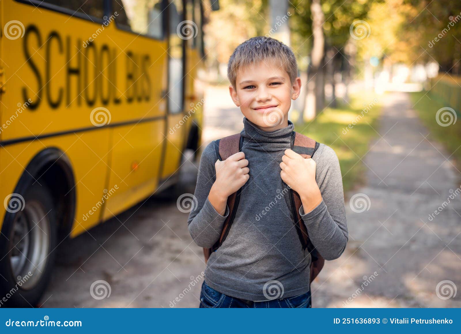 Cheerful Young Boy with a Backpack Returning Home by School Bus Stock ...