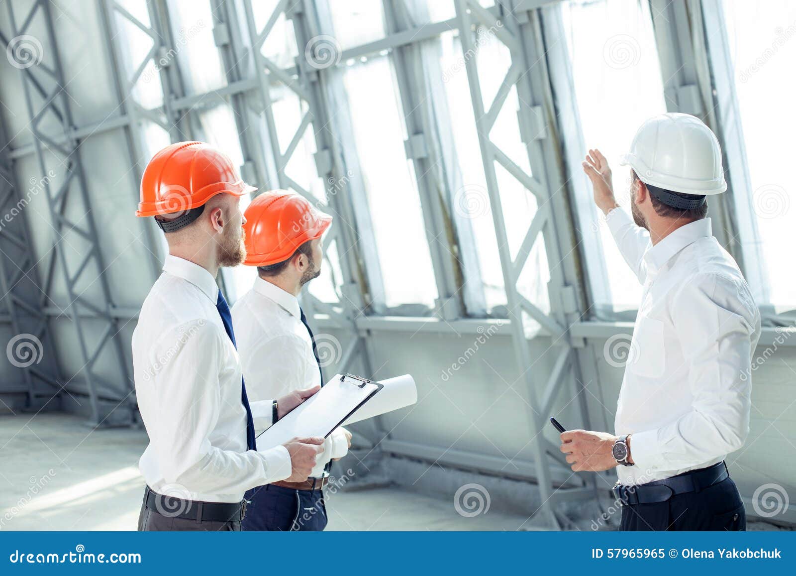 Cheerful Young Builders are Discussing Their Stock Image - Image of ...