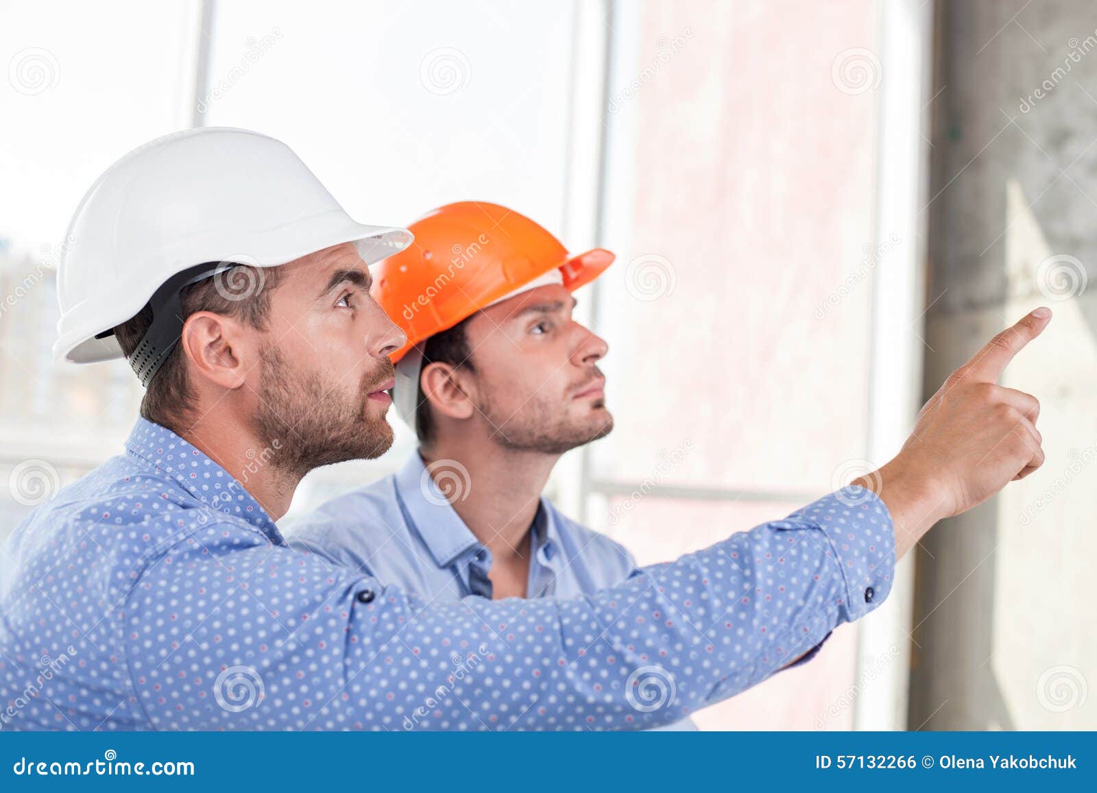Cheerful Young Builders are Working on a Project Stock Photo - Image of ...