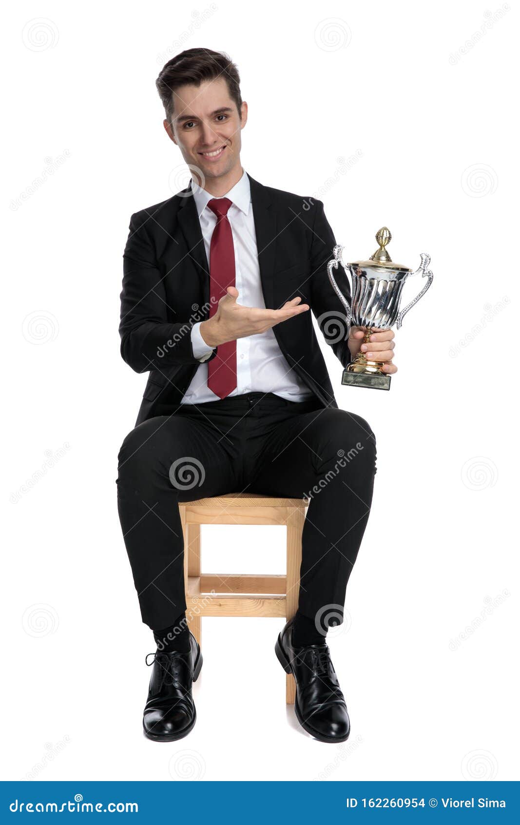 Cheerful Young Businessman Presenting His Trophy Stock Photo - Image of ... Cheerful Young Businessman Presenting His Trophy Stock Photo - Image of ...