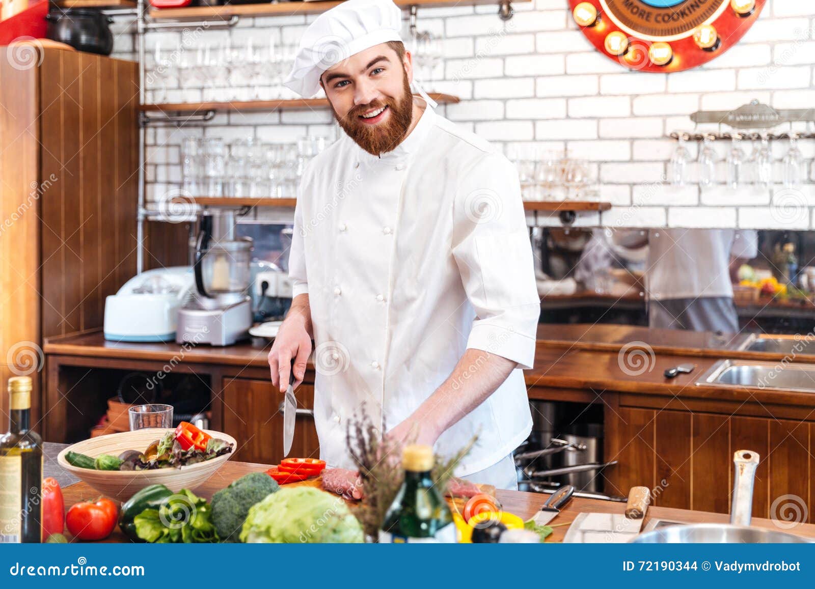 Cheerful Young Chef Cook Cutting Meat and Making Vegetable Salad Stock ...