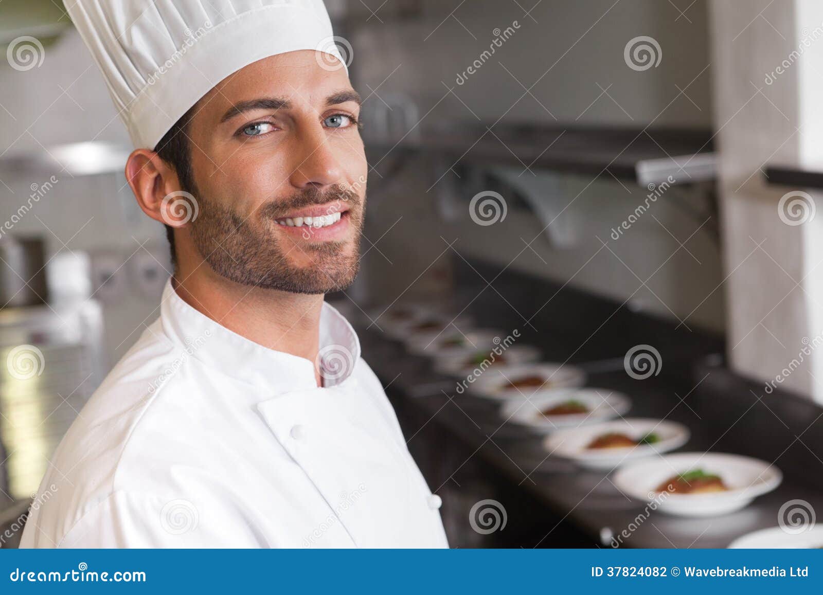 Cheerful Young Chef Smiling at Camera Stock Photo - Image of restaurant ...
