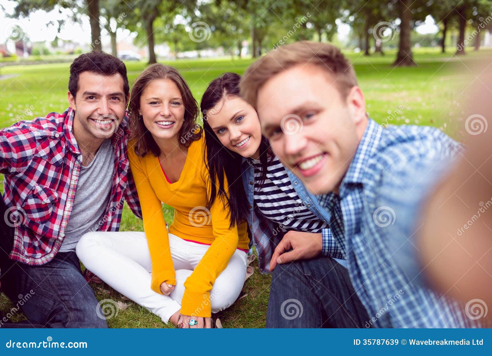 Cheerful Young College Students in Park Stock Image - Image of ...