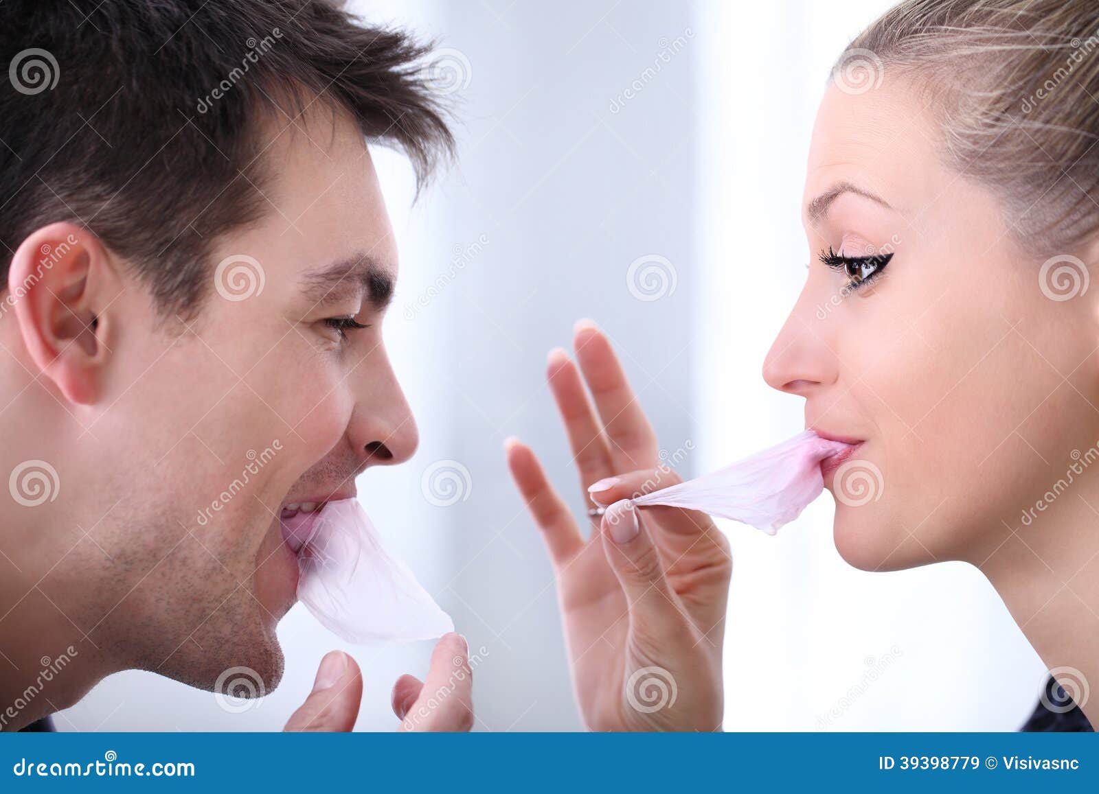 Cheerful Young Couple Playing with Chewing Gum Stock Image - Image of ...