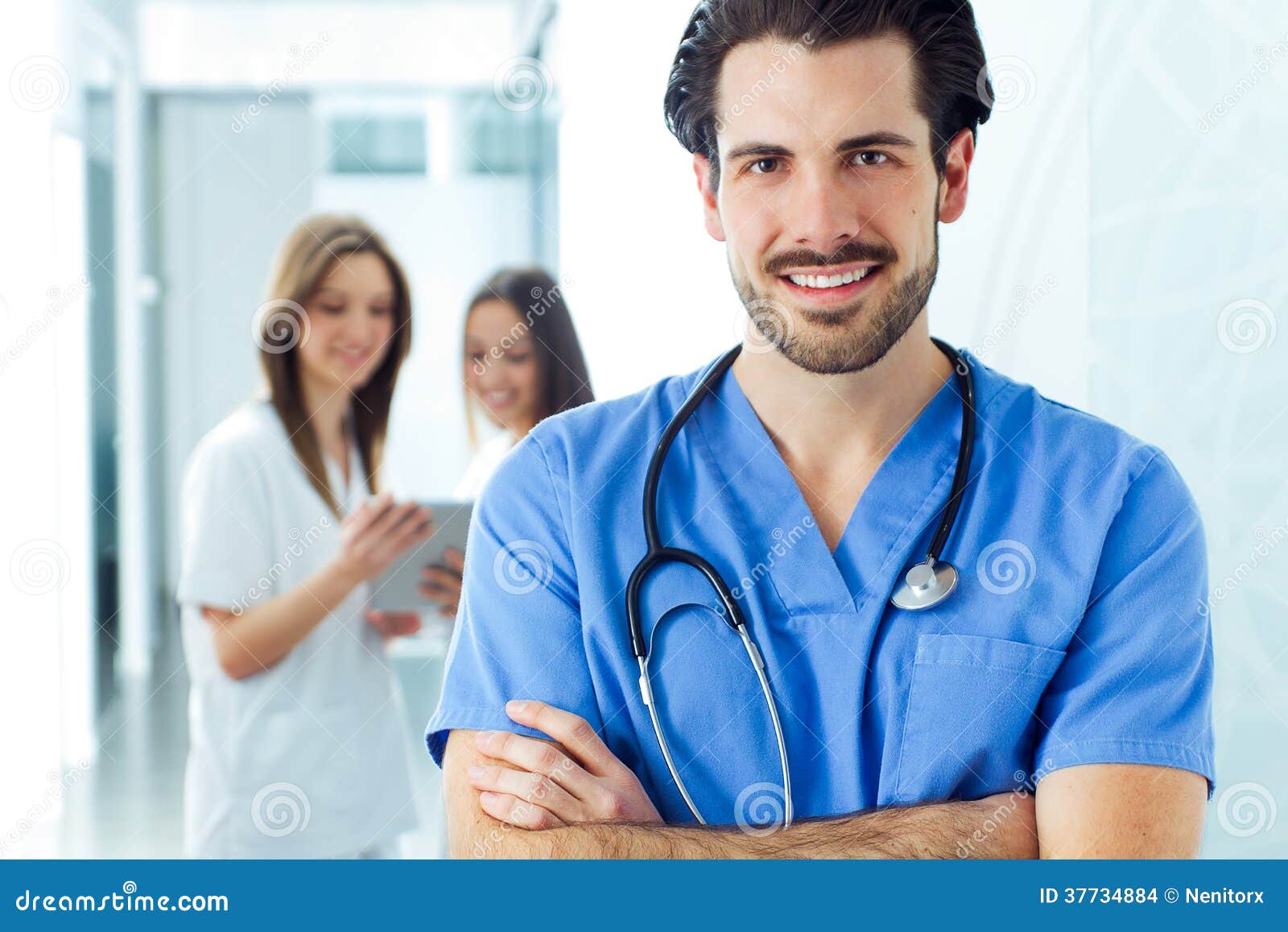 Cheerful Young Doctor Leading His Team Stock Photo - Image of closeup ...