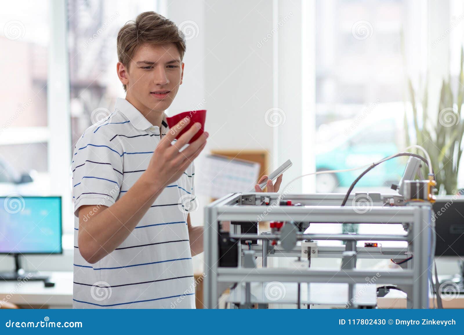 Cheerful Young Engineer Looking for Flaws in Bell Pepper Stock Photo ...