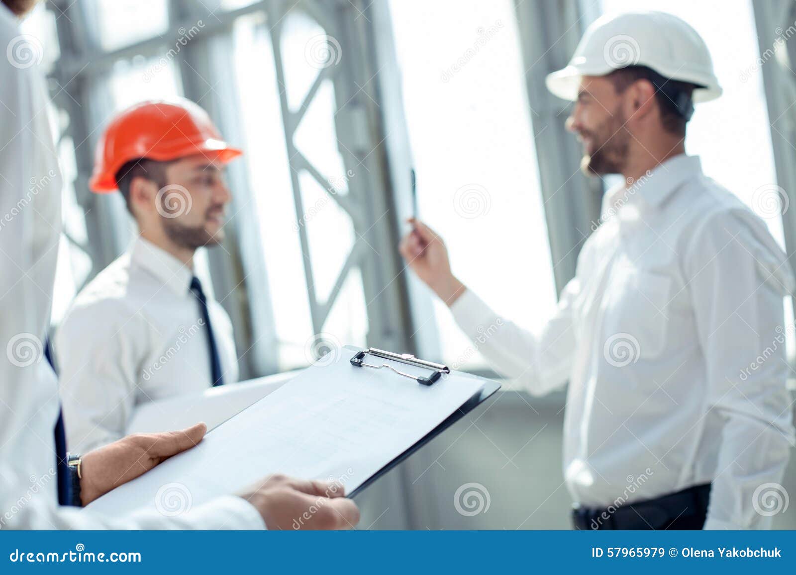 Cheerful Young Engineers are Discussing a New Stock Image - Image of ...