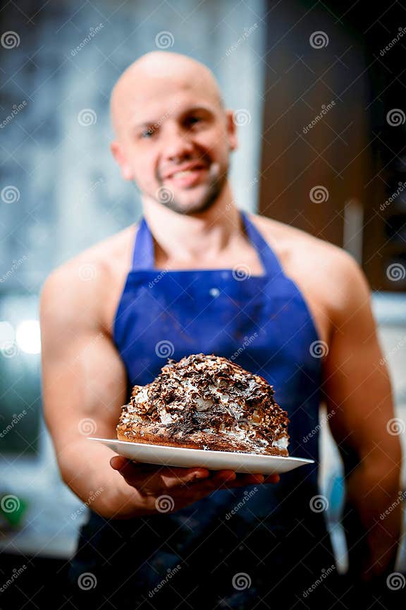 Cheerful Young Man with a Cake Stock Photo - Image of kitchen, food ...