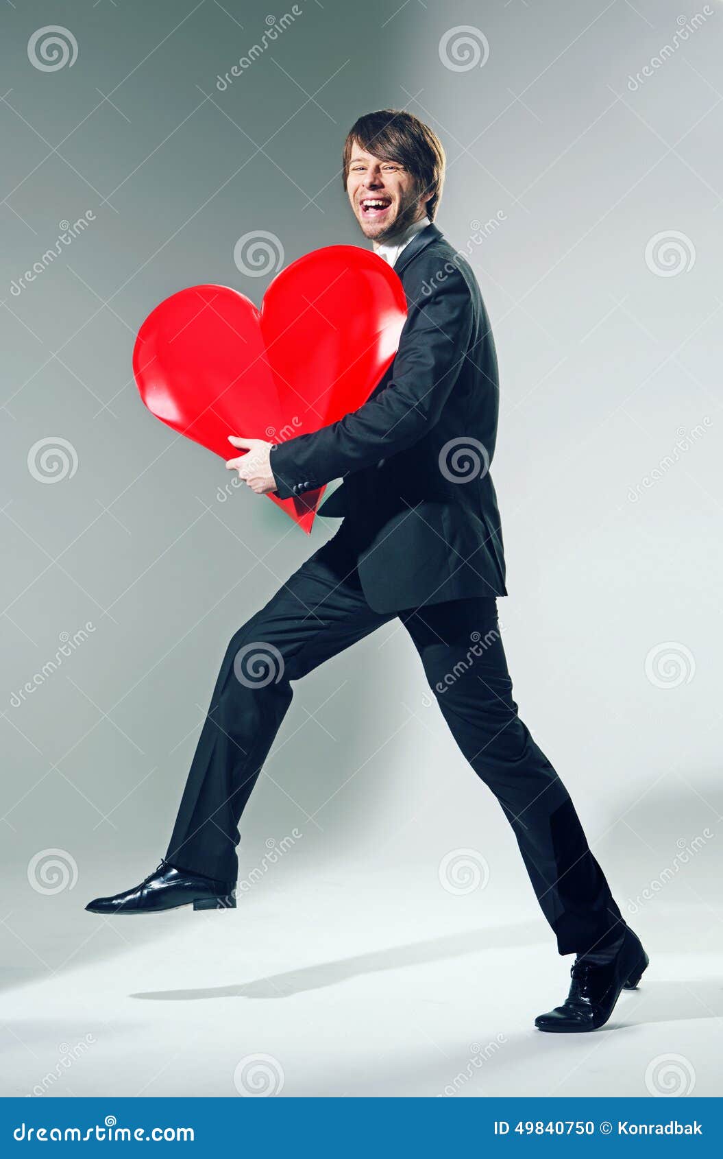 Cheerful Young Man Holding Big Heart Stock Photo - Image of home, lover ...
