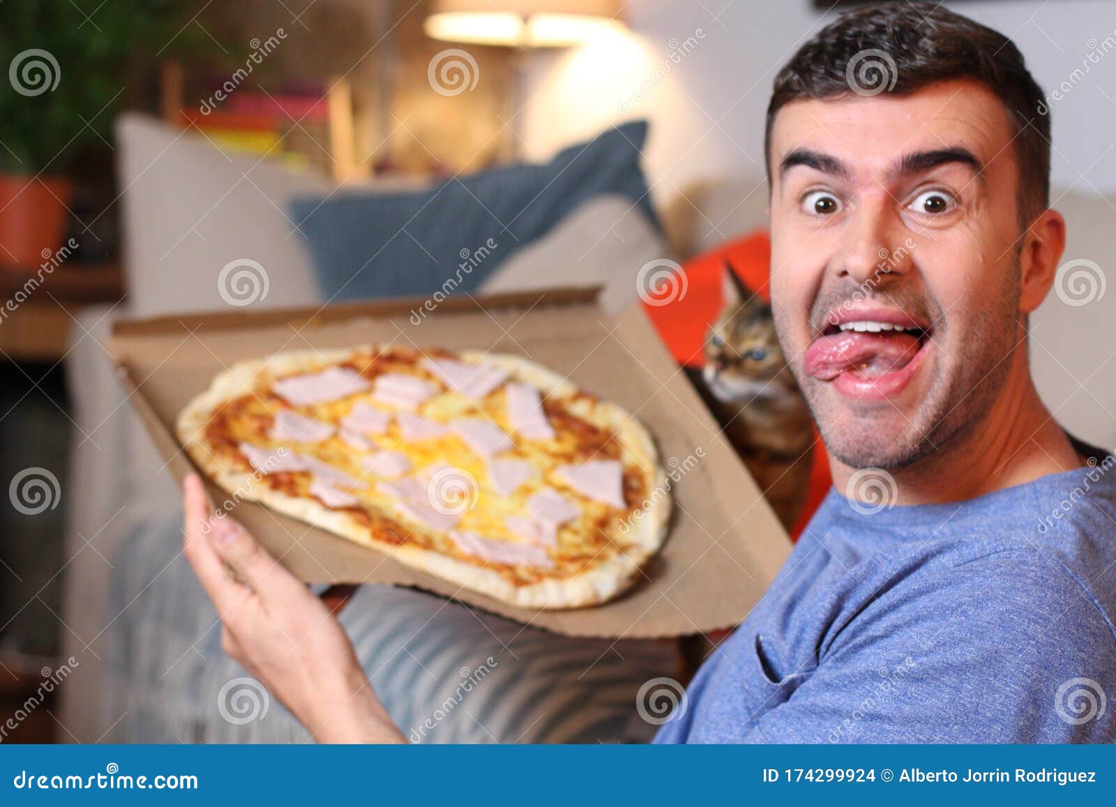 Cheerful Young Man Holding a Pizza Stock Photo - Image of adult ...