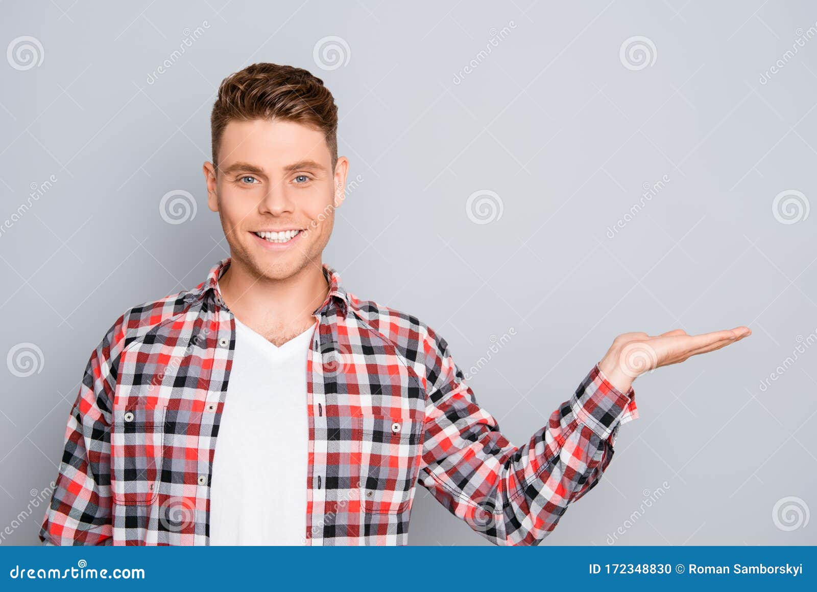 Cheerful Young Man Making Presention of New Product Stock Photo - Image ...