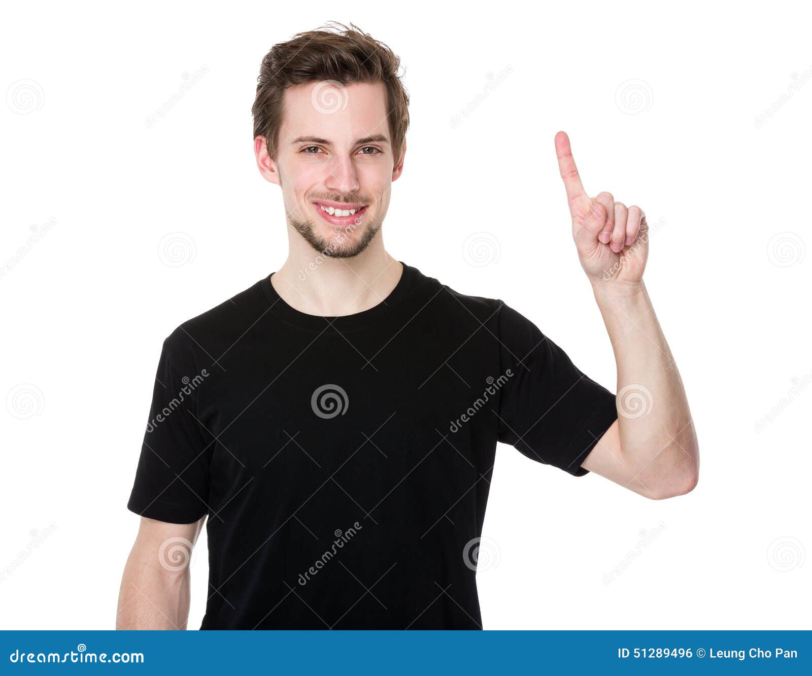 Cheerful Young Man Pointing Towards Something Interesting Stock Photo ... Cheerful Young Man Pointing Towards Something Interesting Stock Photo ...